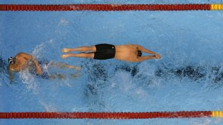 Olympic diving pool turns green