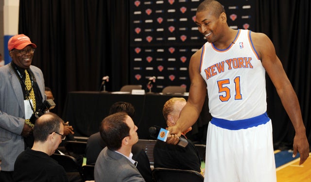 Metta World Peace signs in Italy - CBSSports.com