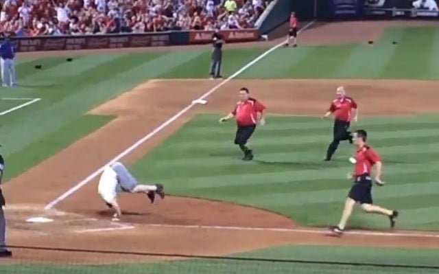 LOOK: Fan runs on the field at Busch Stadium, somersaults on home plate ...