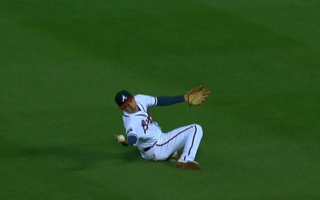 WATCH: Braves' Daniel Castro makes barehanded circus catch - CBSSports.com